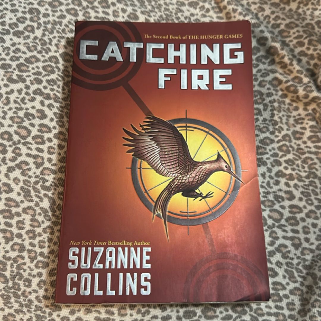 Catching Fire by Suzanne Collins, Paperback | Pangobooks