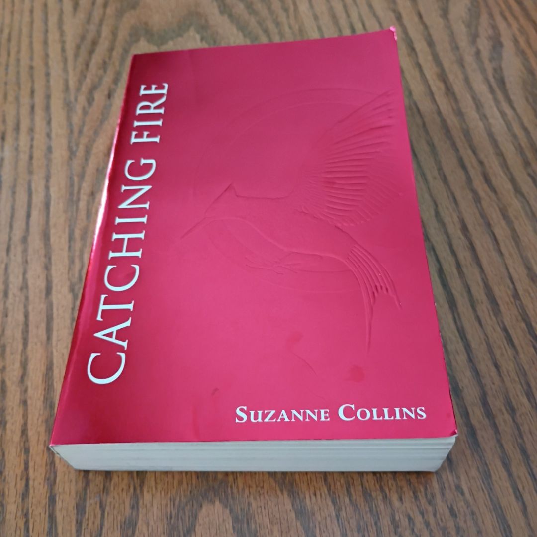 Catching Fire by Suzanne Collins, Paperback | Pangobooks